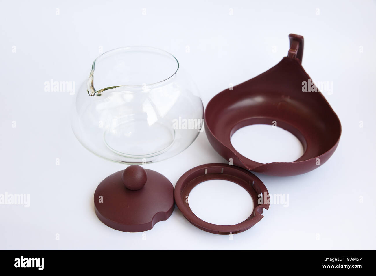 Empty glass teapot on white background Stock Photo - Alamy