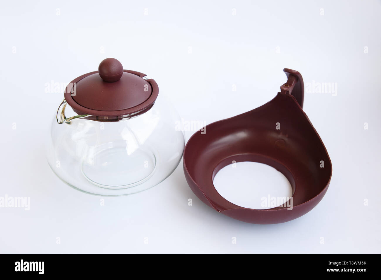 Empty glass teapot on white background Stock Photo - Alamy