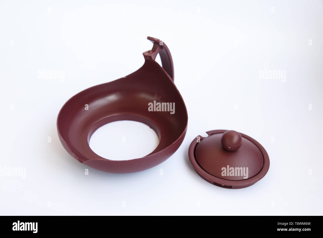 Empty glass teapot on white background Stock Photo - Alamy