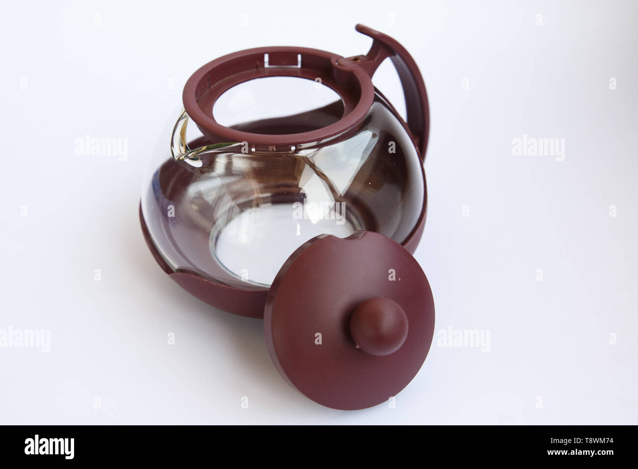 Empty glass teapot on white background Stock Photo - Alamy