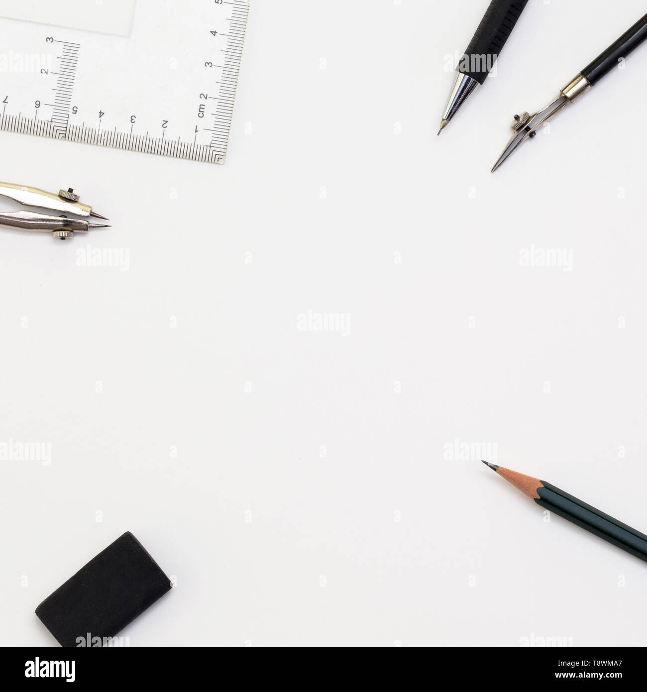 Background with white paper, pencils and eraser. Workplace for the ...
