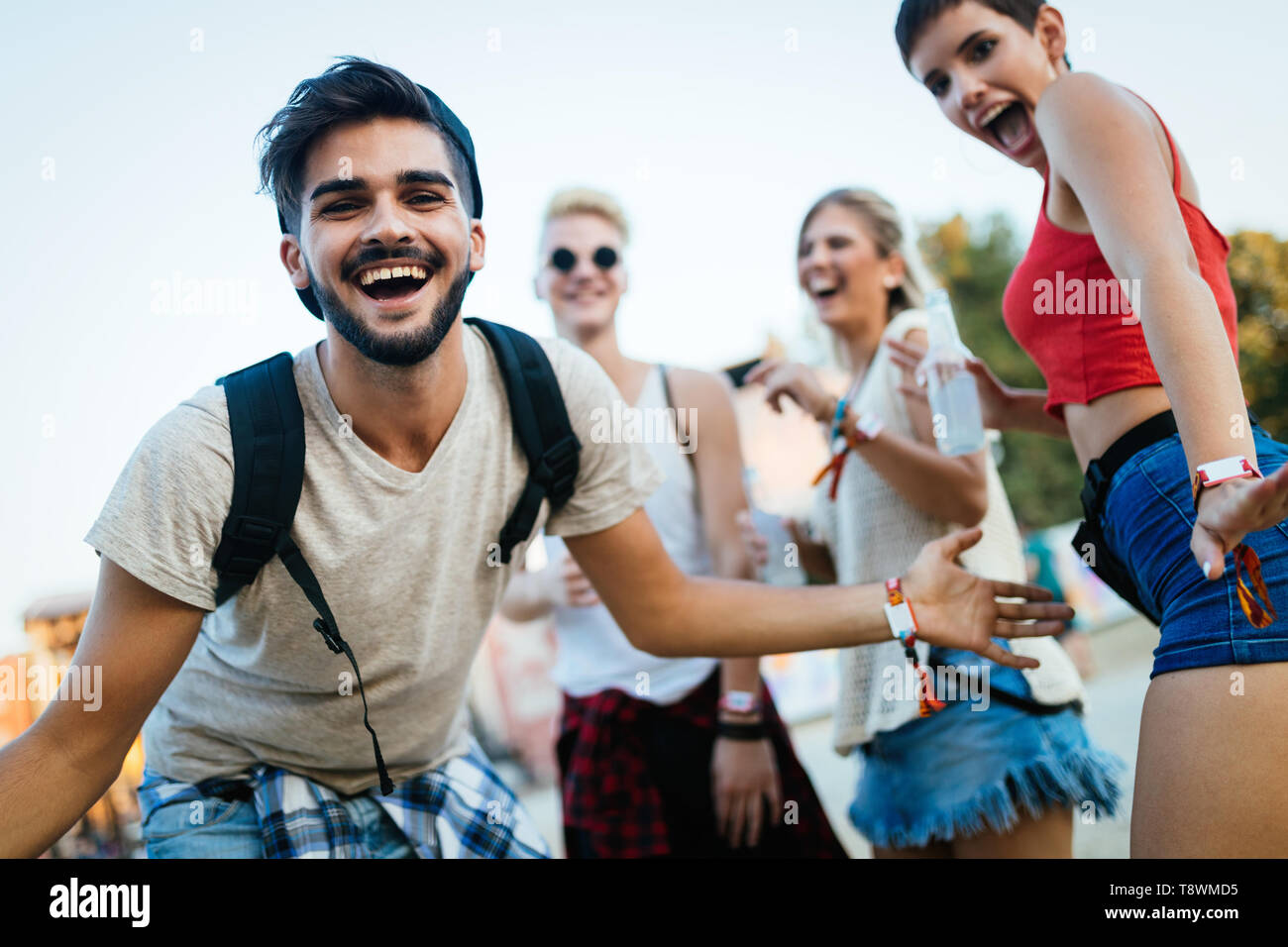 Happy friends having fun at music festival Stock Photo - Alamy