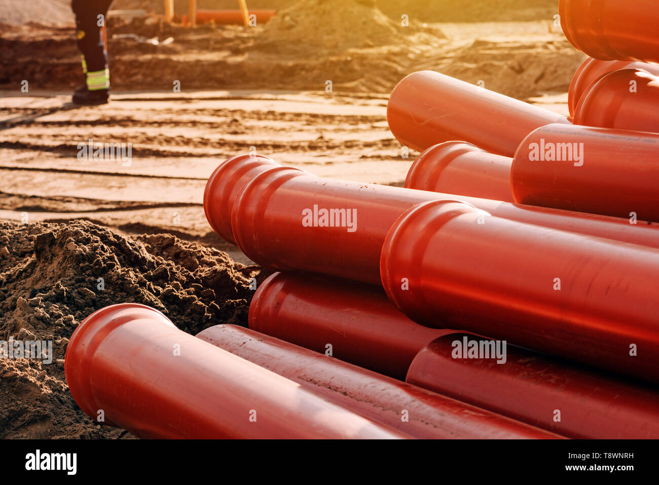 Plastic sewer pipes on construction site for system repairing stacked ...