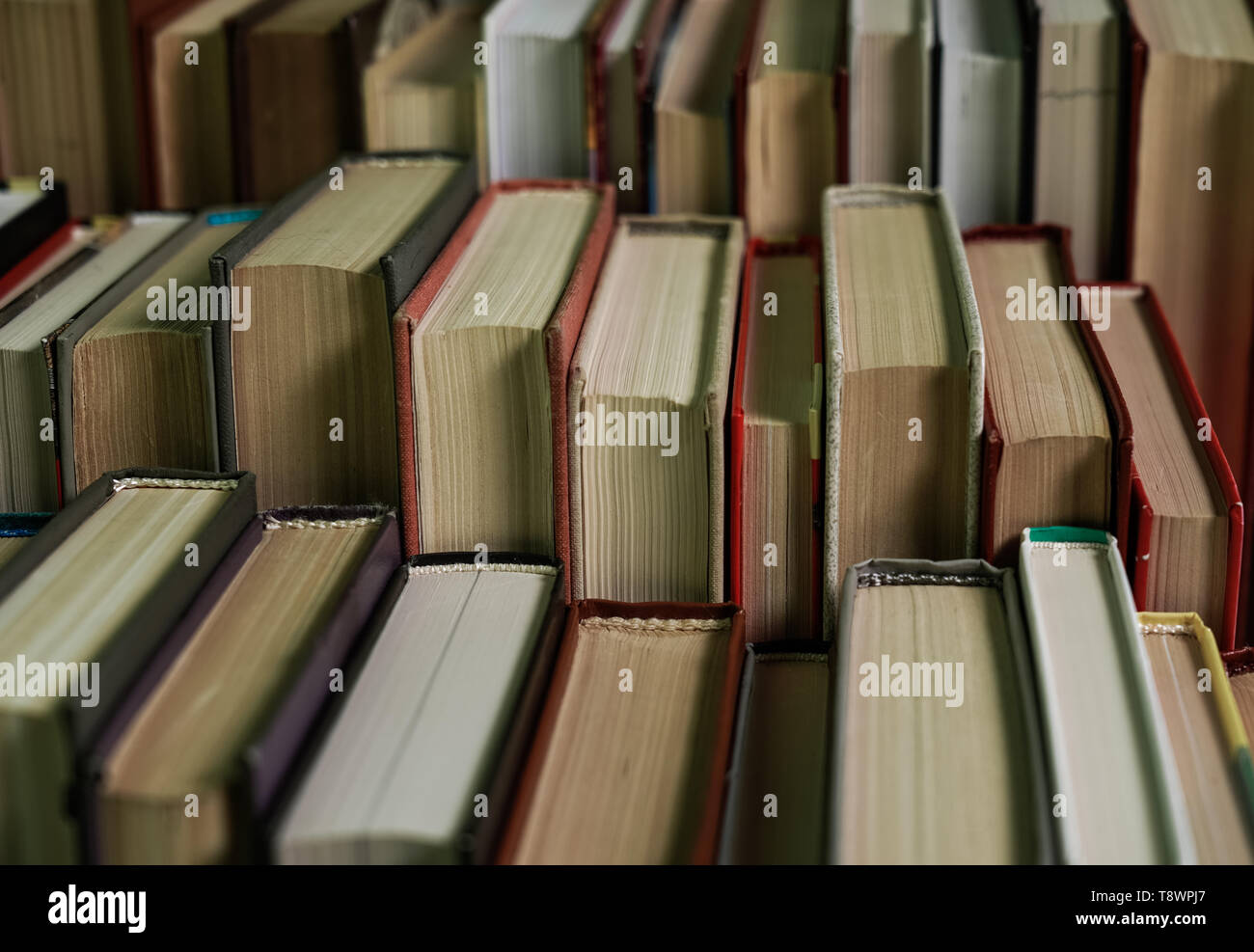 Stack of books background. many books piles. Stack of Books of ...