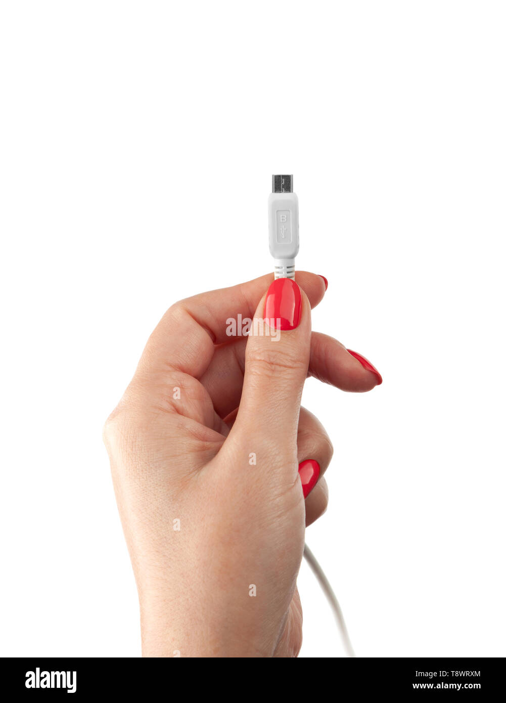 Hand holding USB cable. Female hand holding charging cable. Isolated on ...