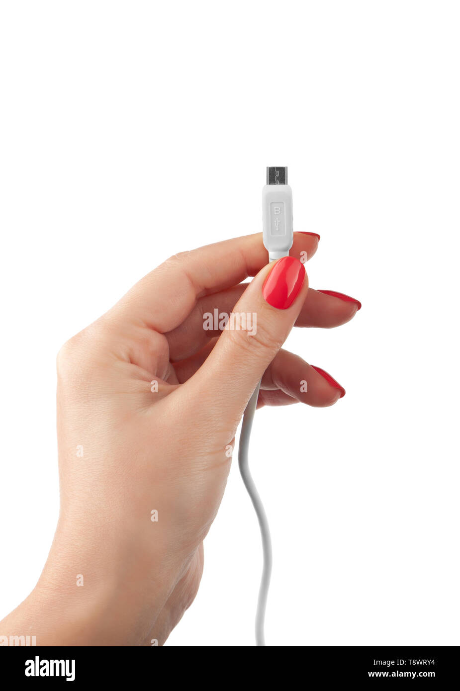 Hand holding USB cable. Female hand holding charging cable. Isolated on ...