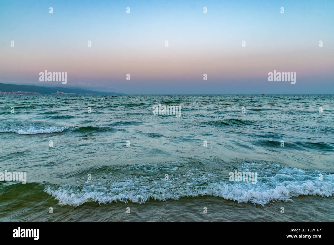 Waves at the beach at sunset in Sunny Beach on the Black Sea coast of ...
