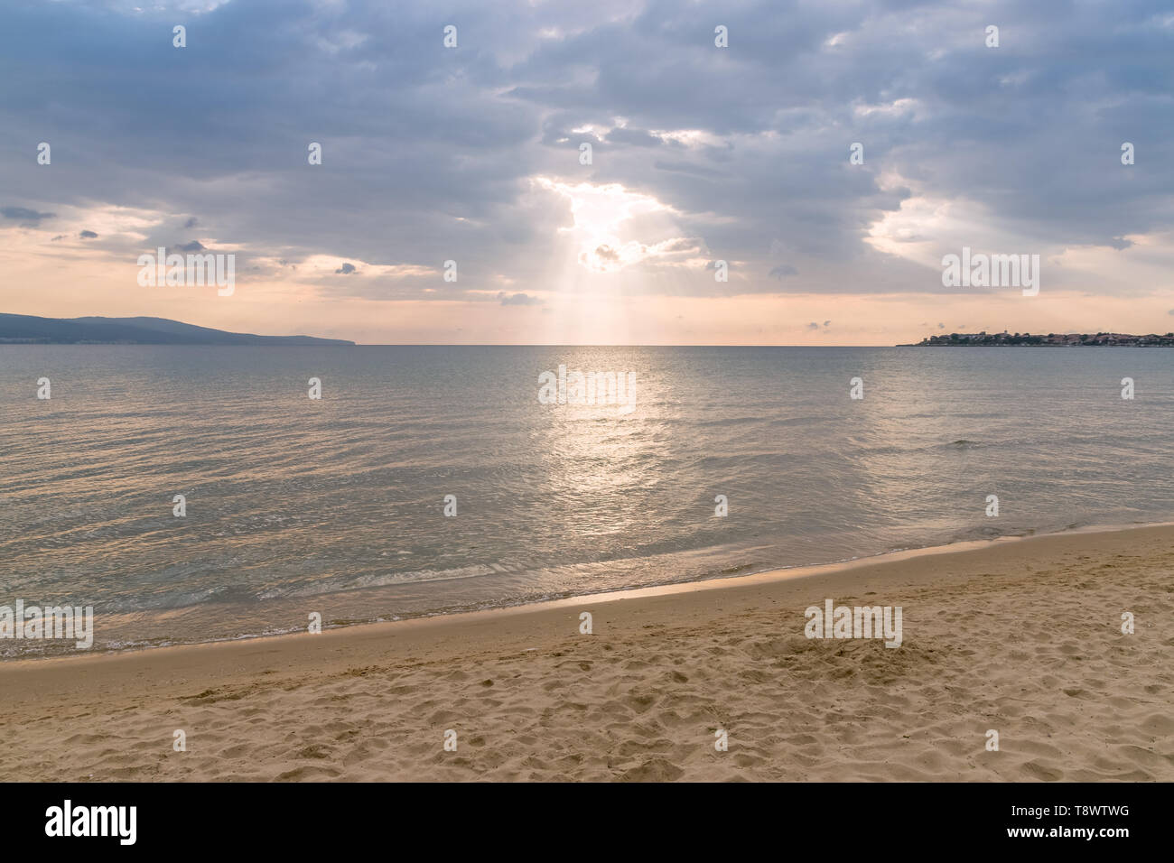 Sun rays peeking through clouds hi-res stock photography and images - Alamy