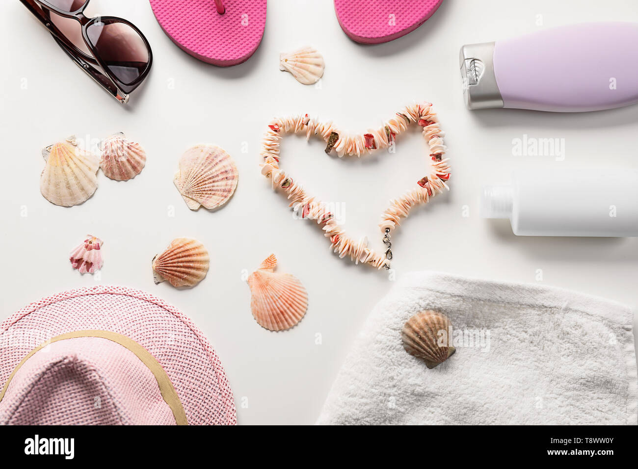 Set of beach items with seashells on white background Stock Photo - Alamy