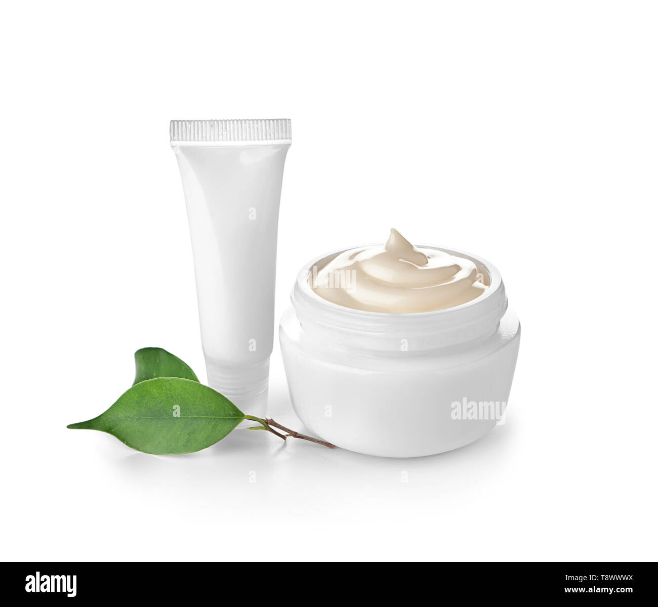 Jar and tube with body cream on white background Stock Photo - Alamy
