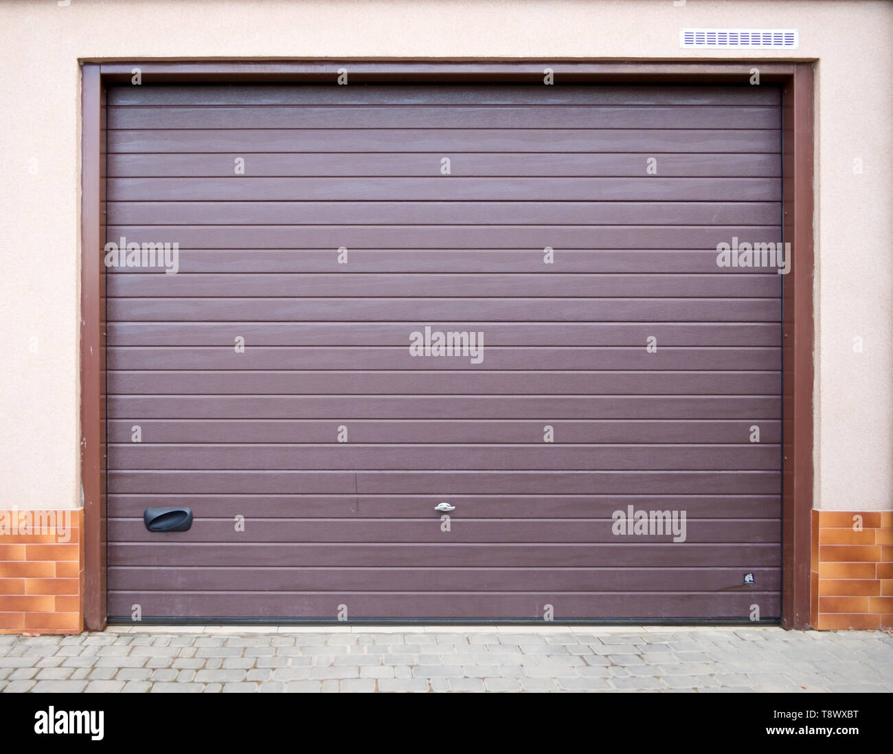 The entrance to the garage is equipped with a roller shutter gate Stock ...