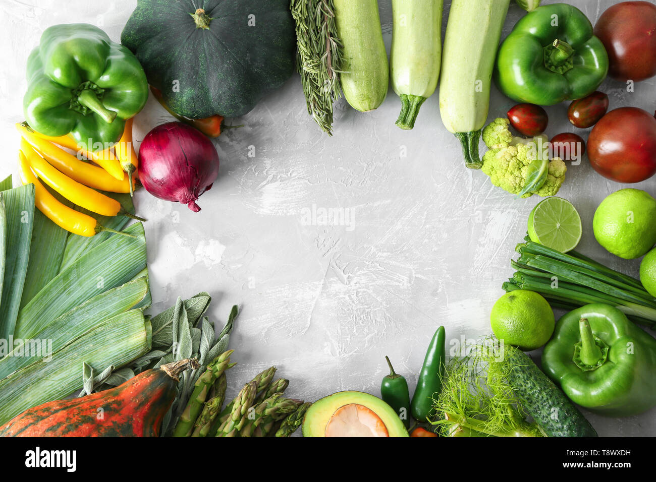 Frame made of various fresh vegetables on grey background Stock Photo ...