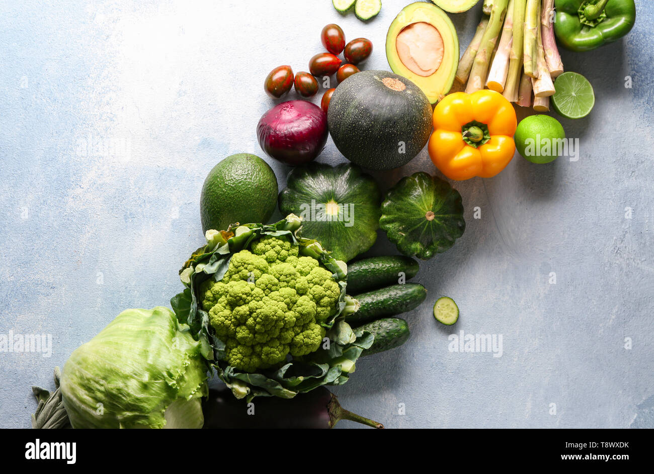 Various fresh vegetables on color table Stock Photo - Alamy