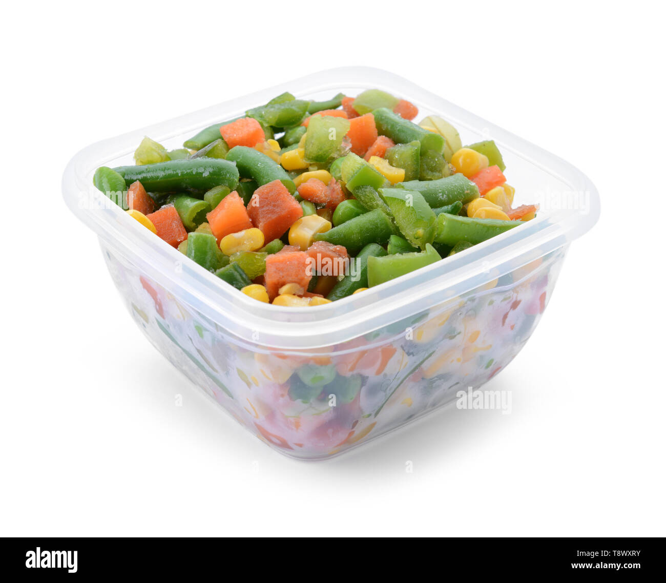 Plastic container with frozen vegetables on white background Stock ...