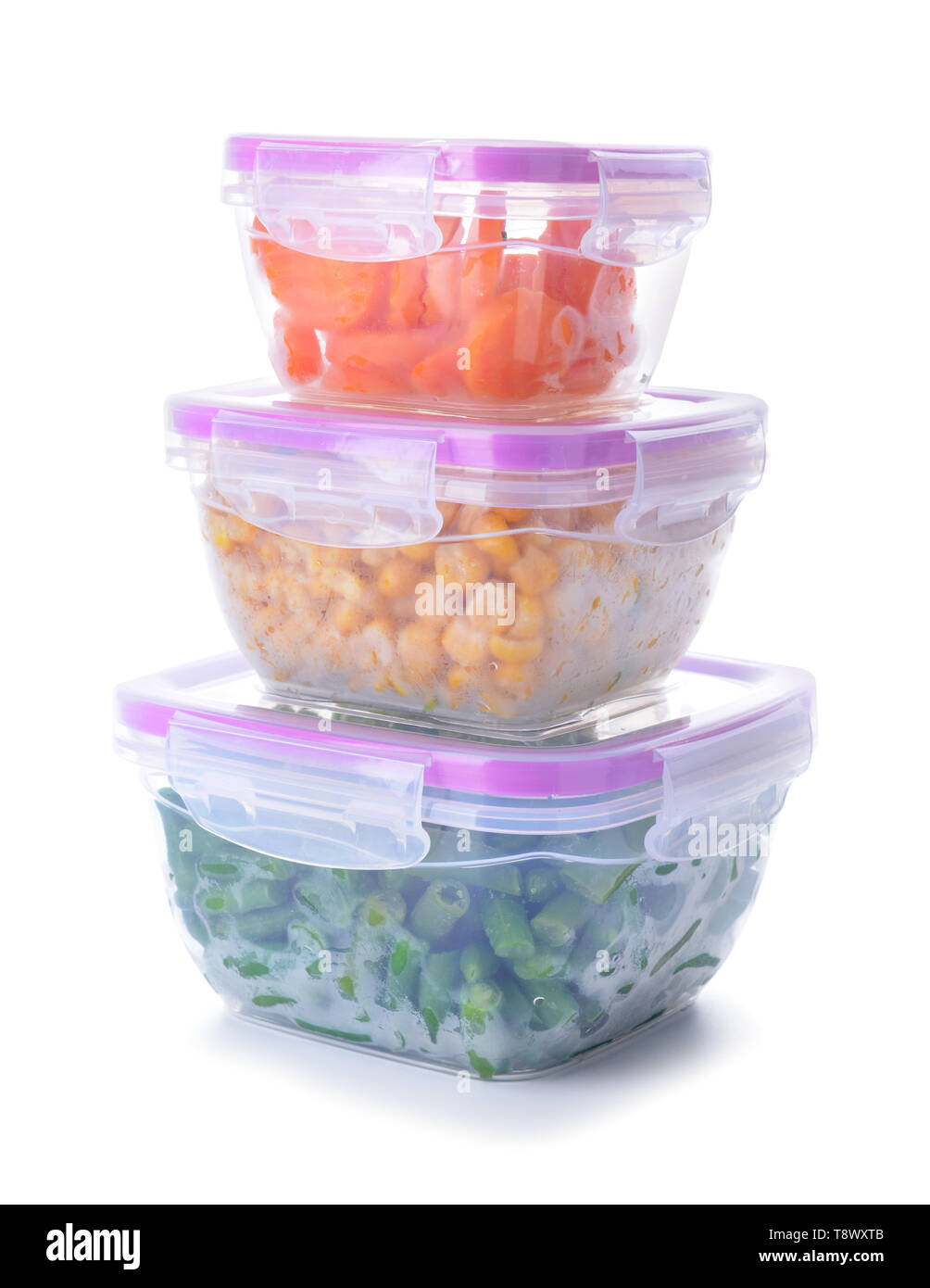 Plastic containers with frozen vegetables on white background Stock ...
