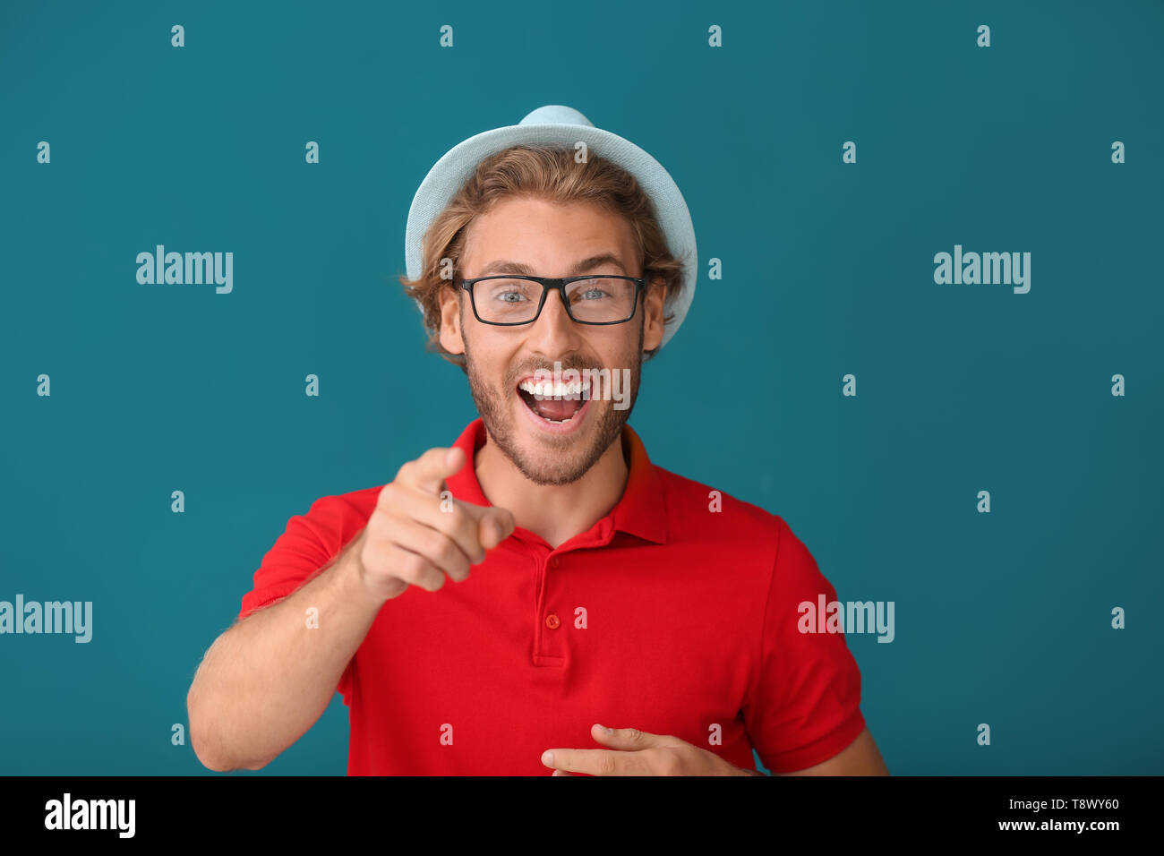 Handsome man pointing viewer hi-res stock photography and images - Alamy