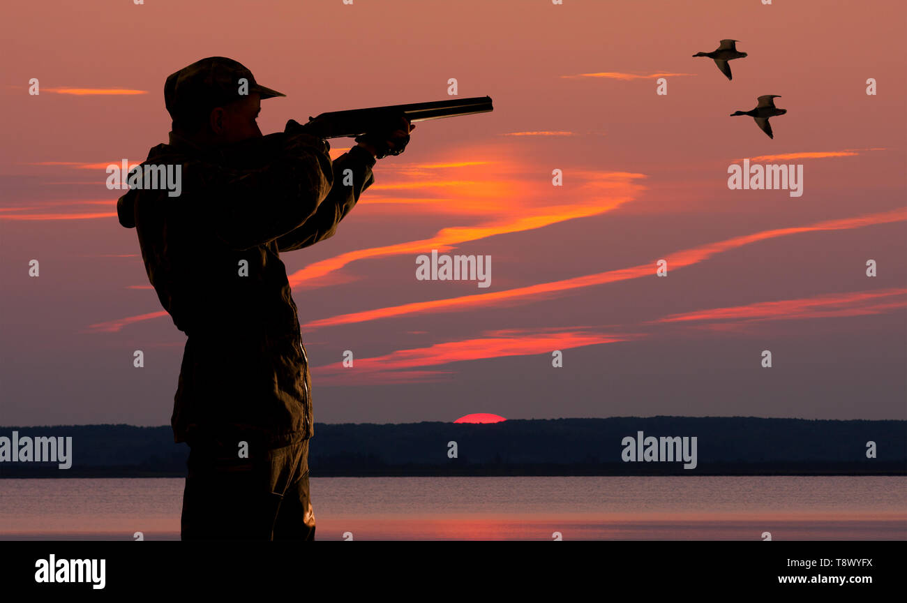 silhouette hunter at sunset background on the hunting Stock Photo - Alamy