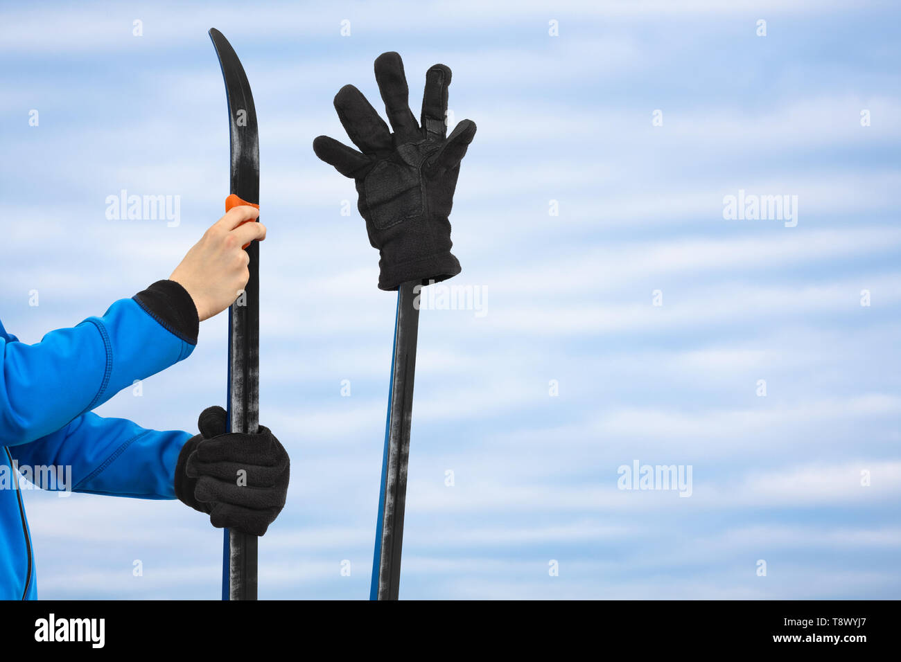 hands skier preparing skis for the race, against the sky Stock Photo ...