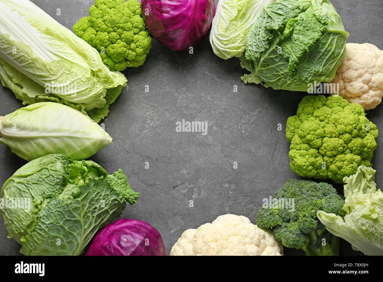 Frame made of different cabbages on grey background Stock Photo - Alamy