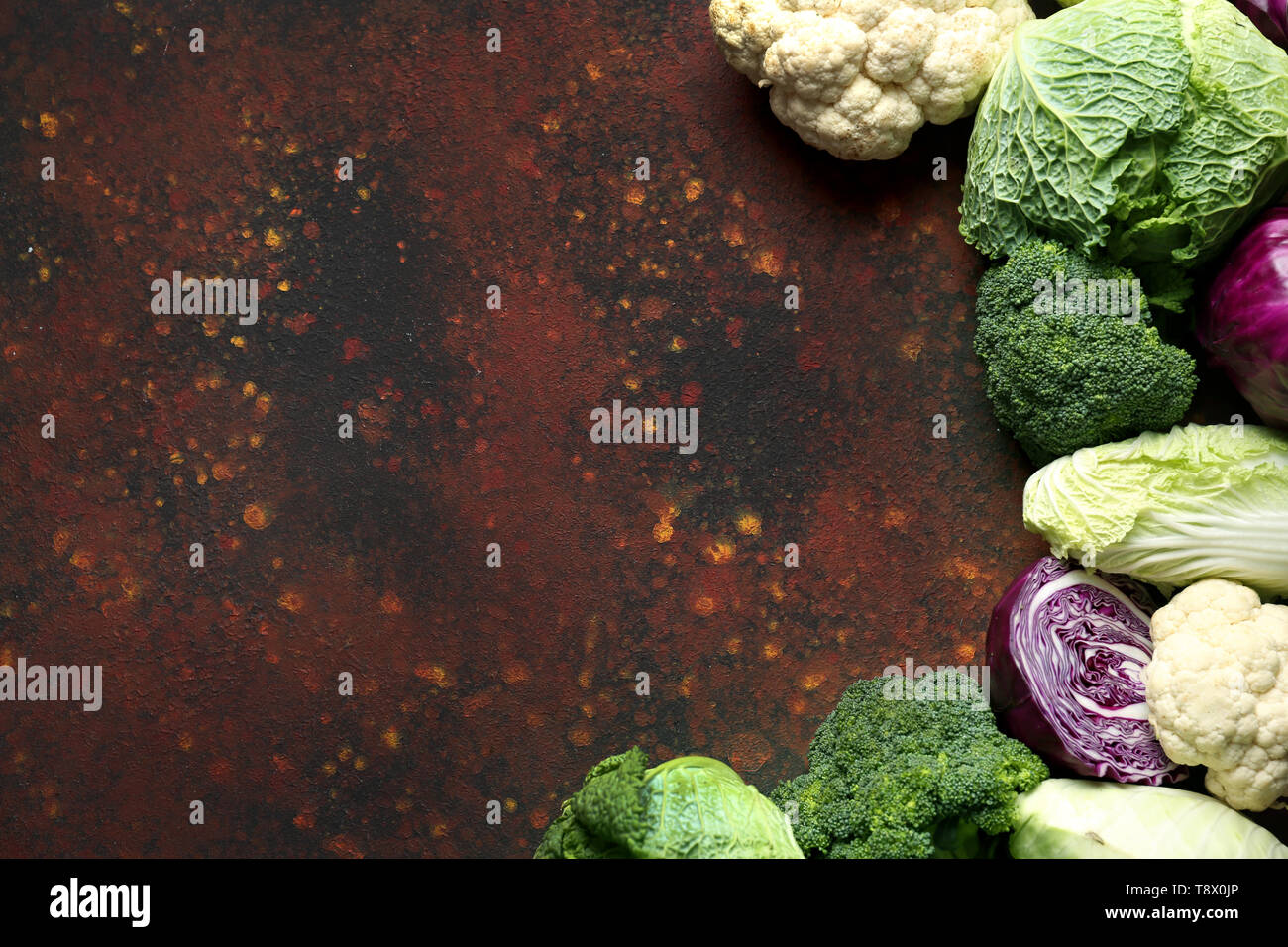 Different kinds of cabbage on color background Stock Photo - Alamy