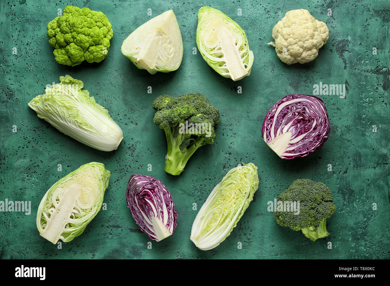 Different kinds of cabbage on color background Stock Photo - Alamy