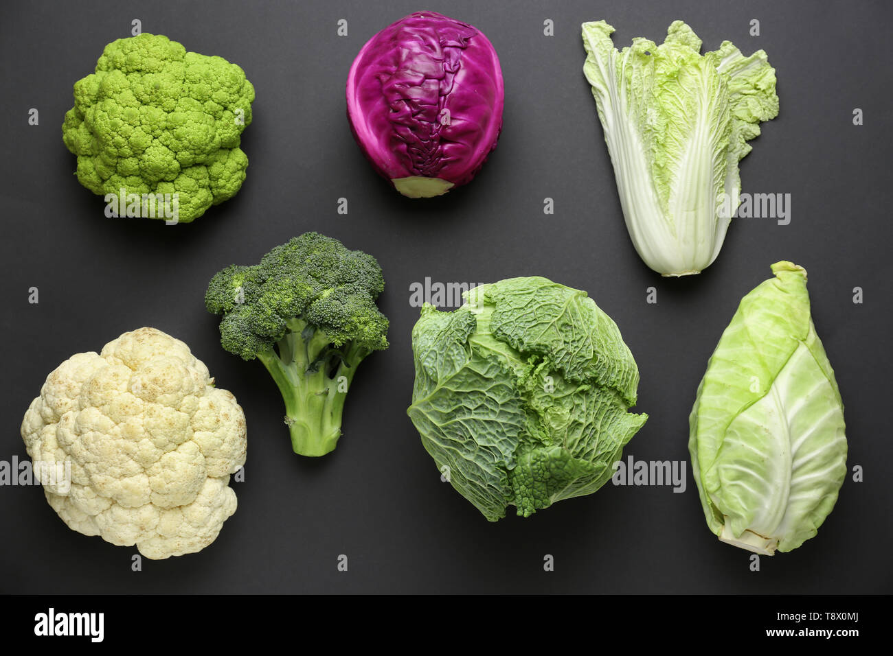 Different kinds of cabbage on dark background Stock Photo - Alamy