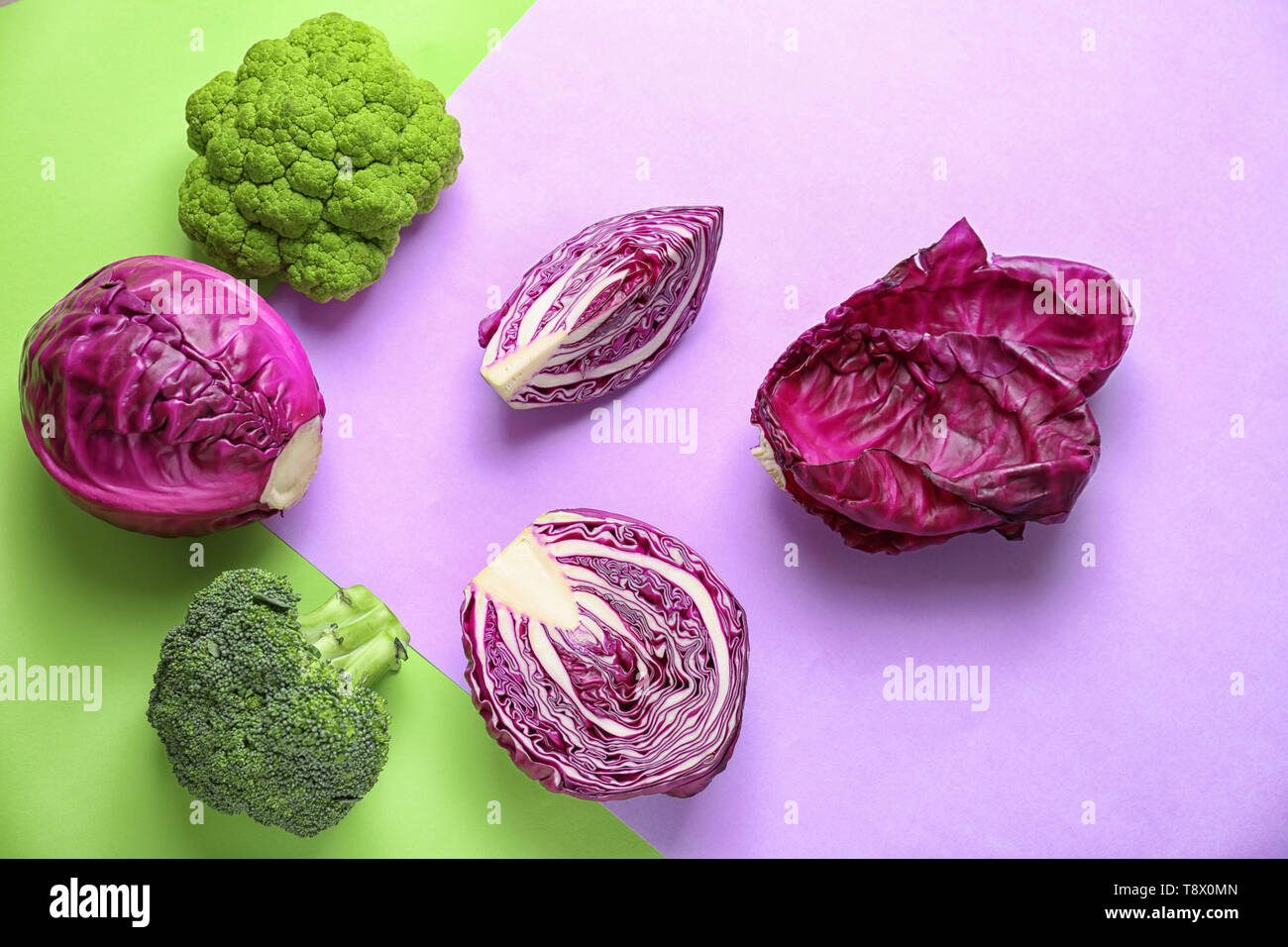 Different kinds of cabbage on color background Stock Photo - Alamy