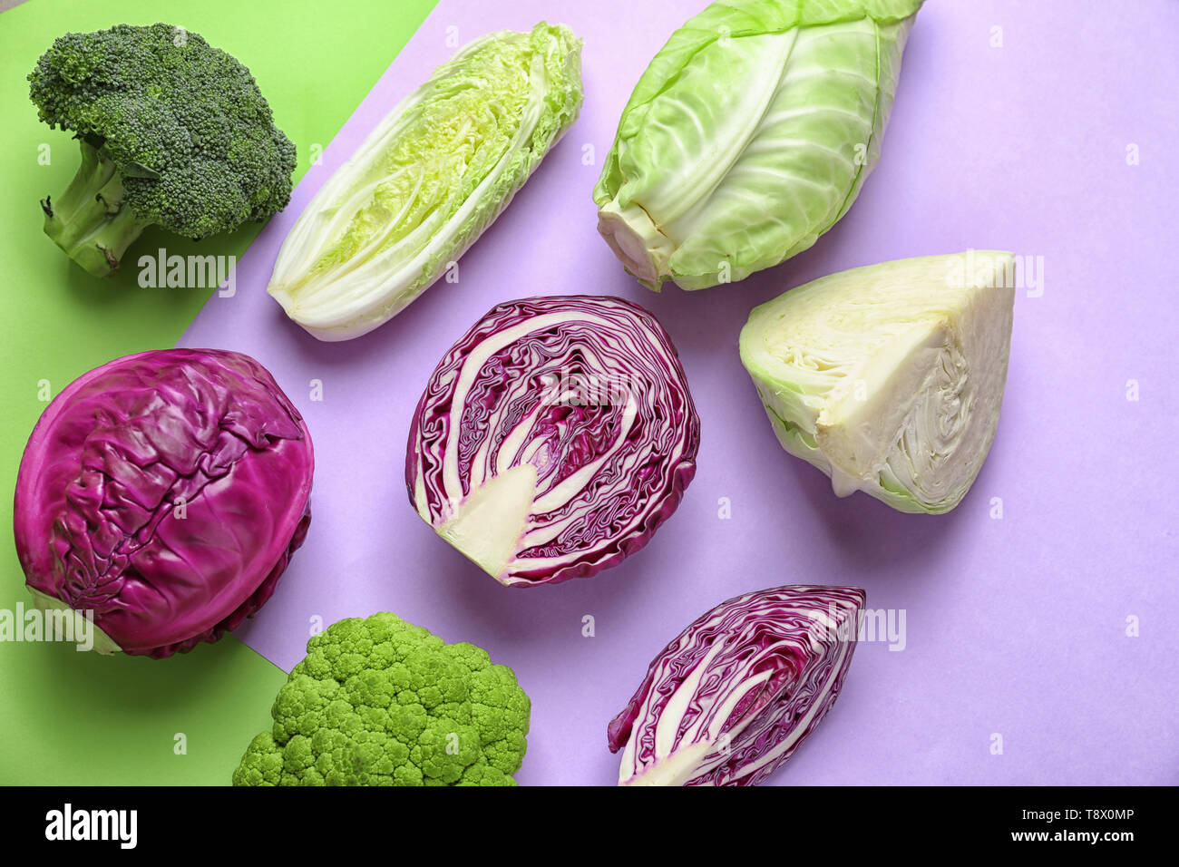 Different kinds of cabbage on color background Stock Photo - Alamy