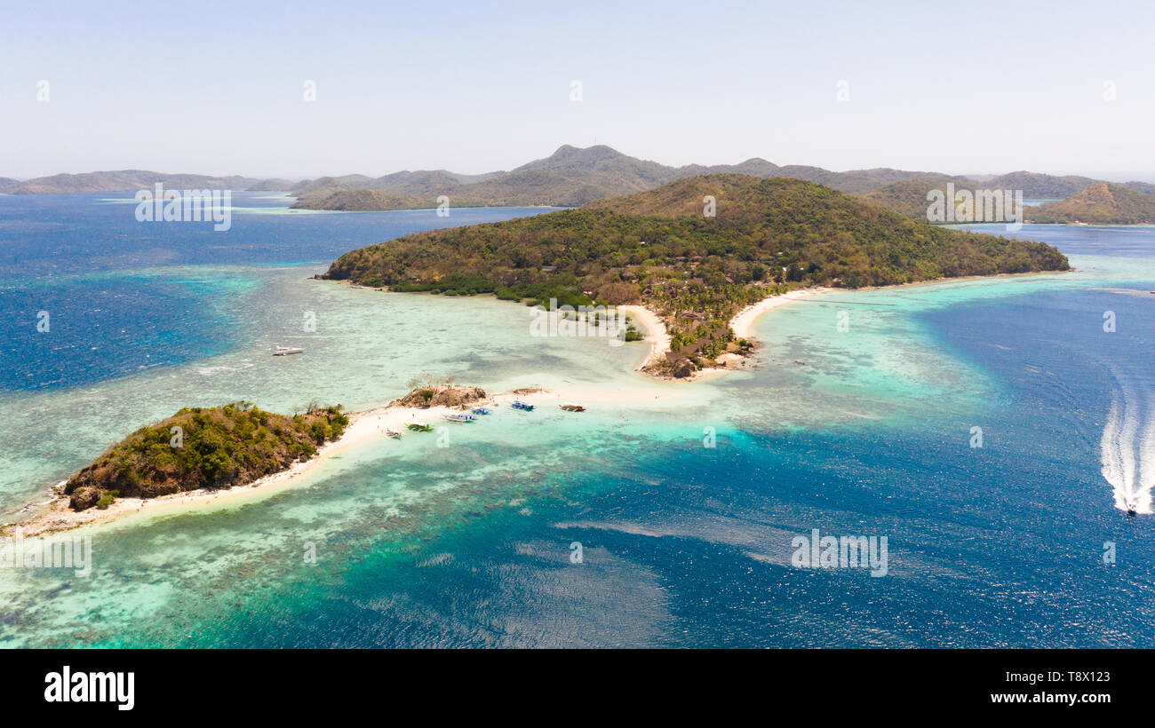 Tropical islands with white beaches. Turquoise lagoon and coral reefs ...