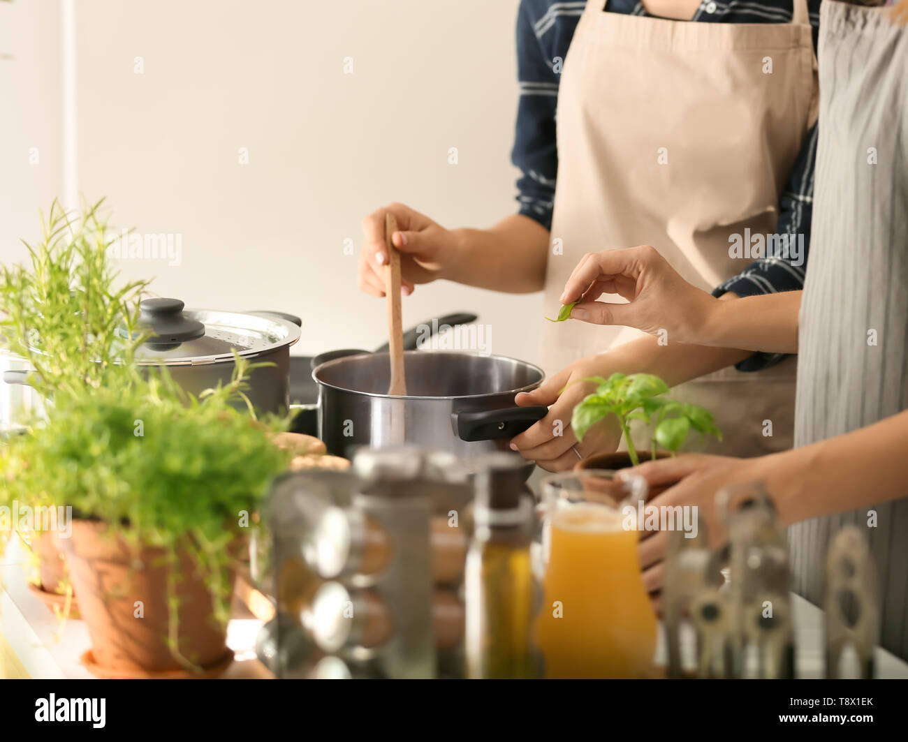 Women cooking together in kitchen Stock Photo - Alamy