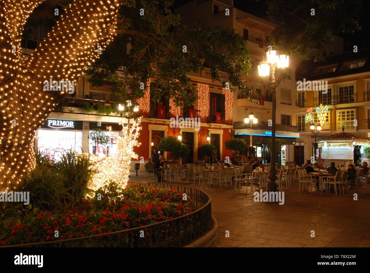 People relaxing at a pavement cafe in Constitution Square (Plaza de la ...