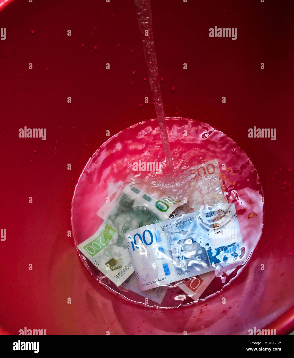 Water tap money hi-res stock photography and images - Alamy