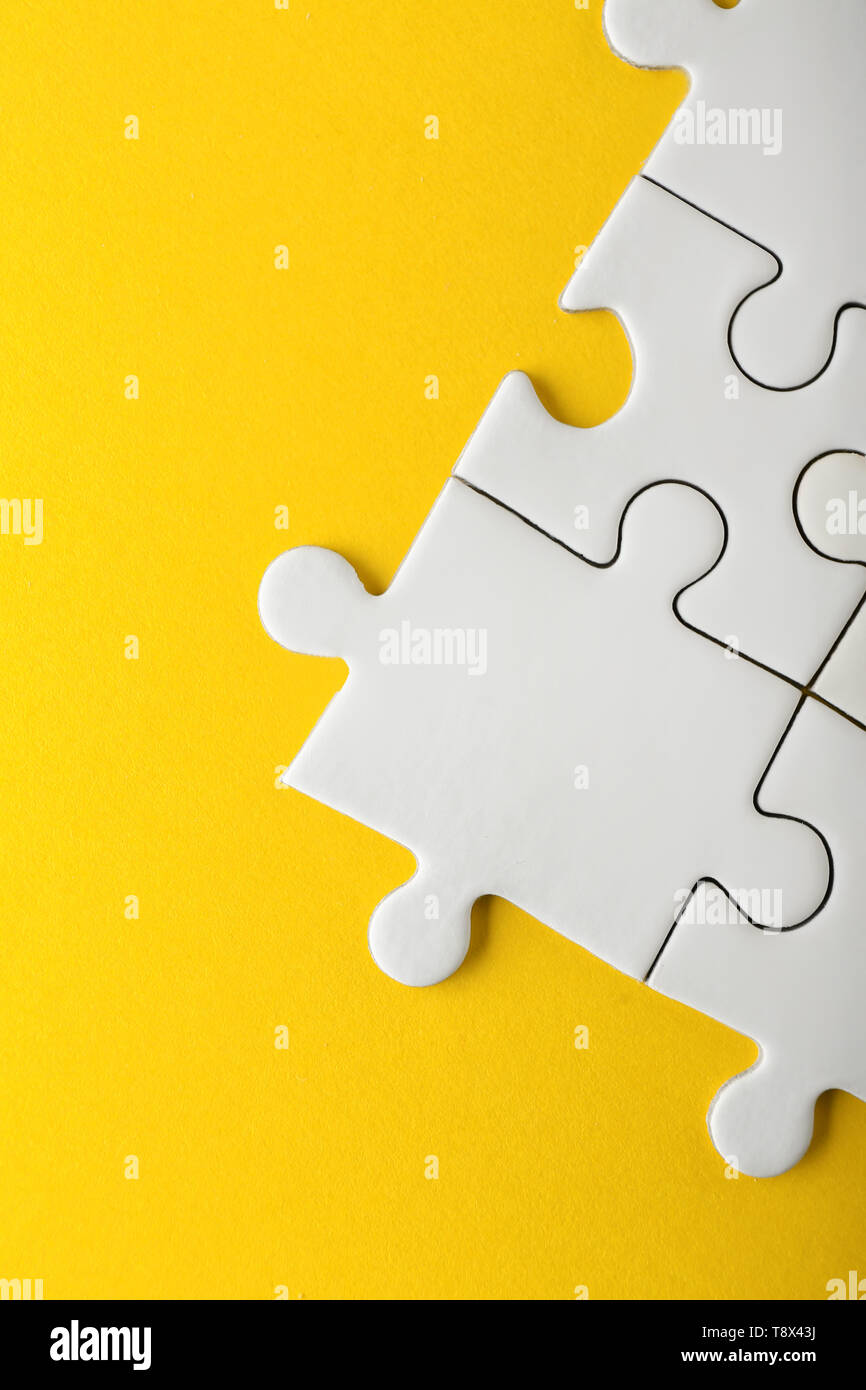 Incomplete jigsaw puzzle on color background Stock Photo - Alamy