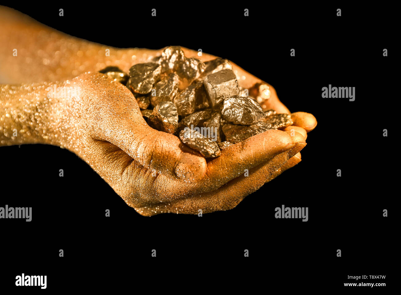 Gold nuggets black hands hi-res stock photography and images - Alamy