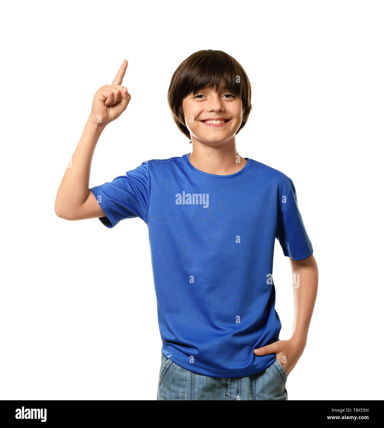 Smiling little boy in t-shirt with raised index finger on white ...