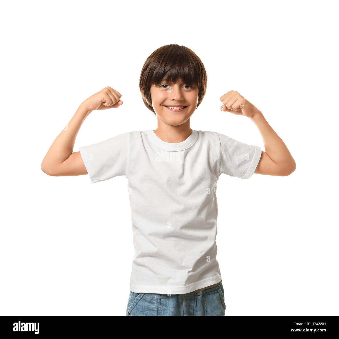 Little boy in t-shirt showing muscles on white background Stock Photo ...