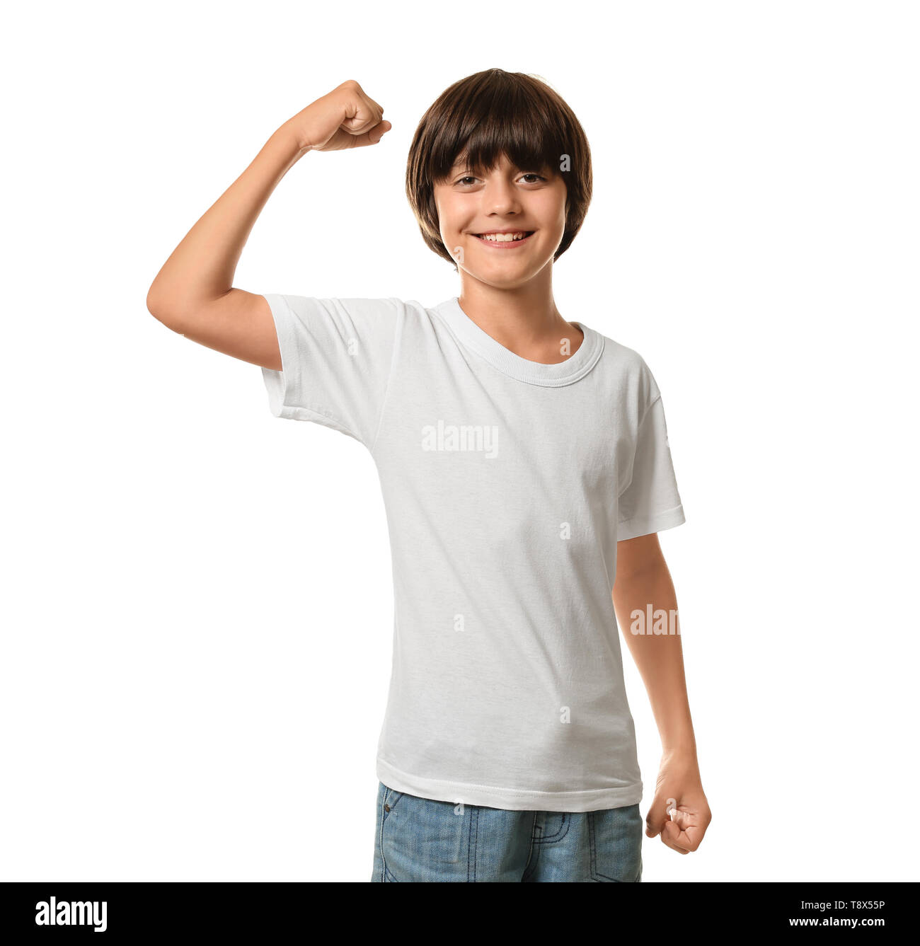 Little boy in t-shirt showing muscles on white background Stock Photo ...