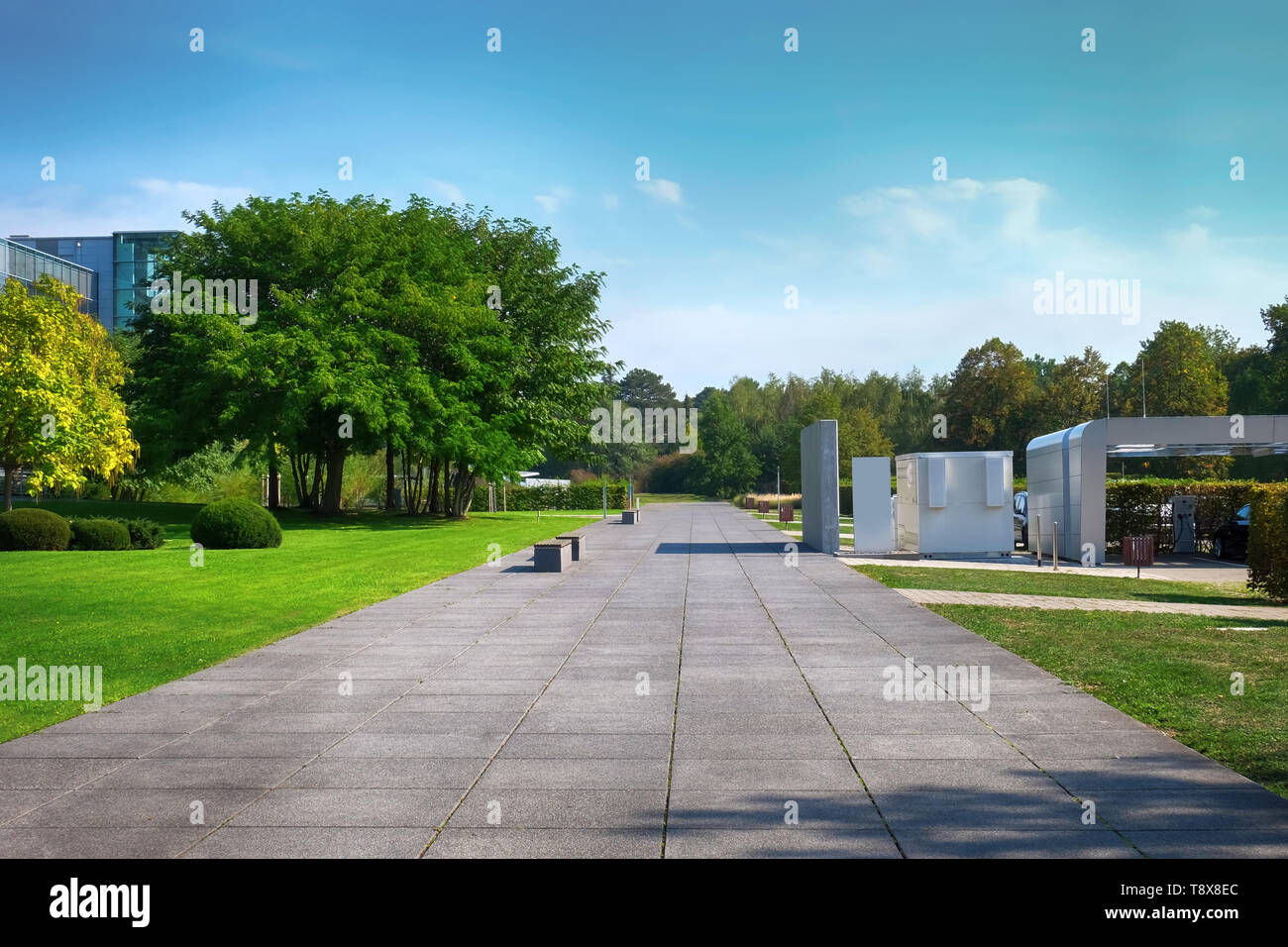 View on pathway in beautiful modern park Stock Photo - Alamy