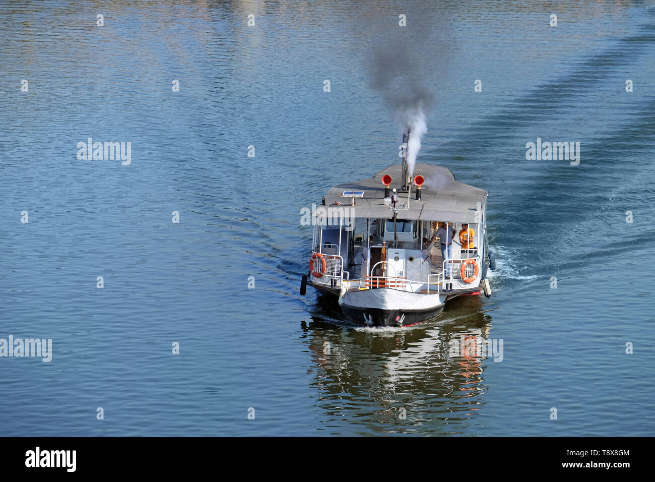 Boat floating down the river Stock Photo - Alamy
