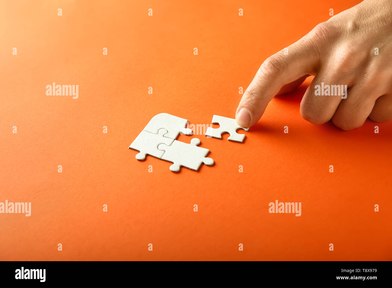 Young people doing jigsaw puzzle hi-res stock photography and images ...