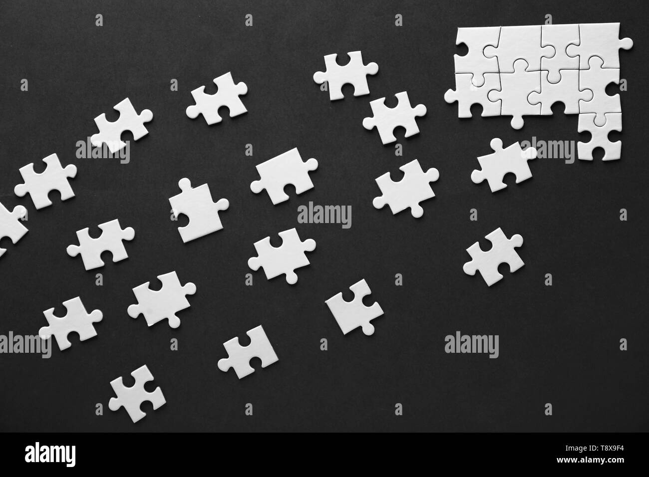Incomplete jigsaw puzzle on color background Stock Photo - Alamy