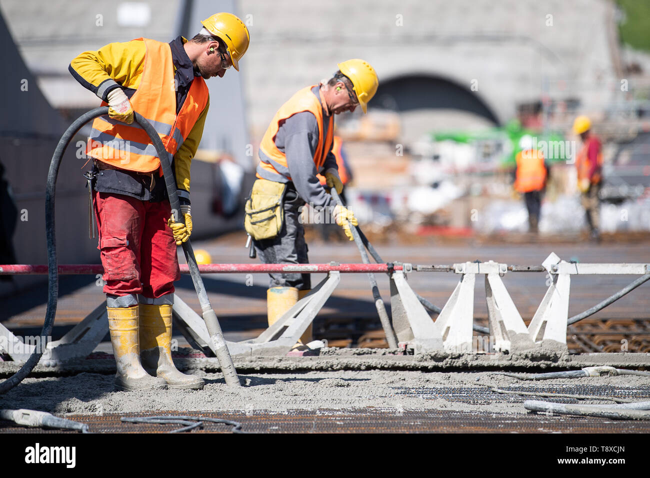 Stuttgart, Germany. 15th May, 2019. Workers pour concrete for the ...