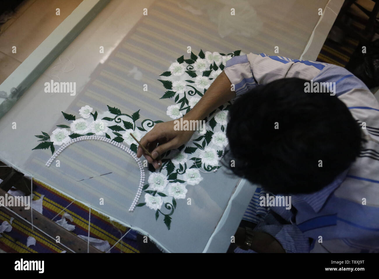 Dhaka, Bangladesh. 15th May, 2019. An artist design handmade embroidery ...