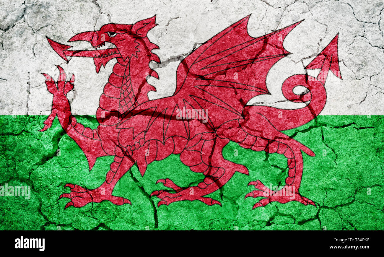 Wales flag on dry earth ground texture background Stock Photo - Alamy