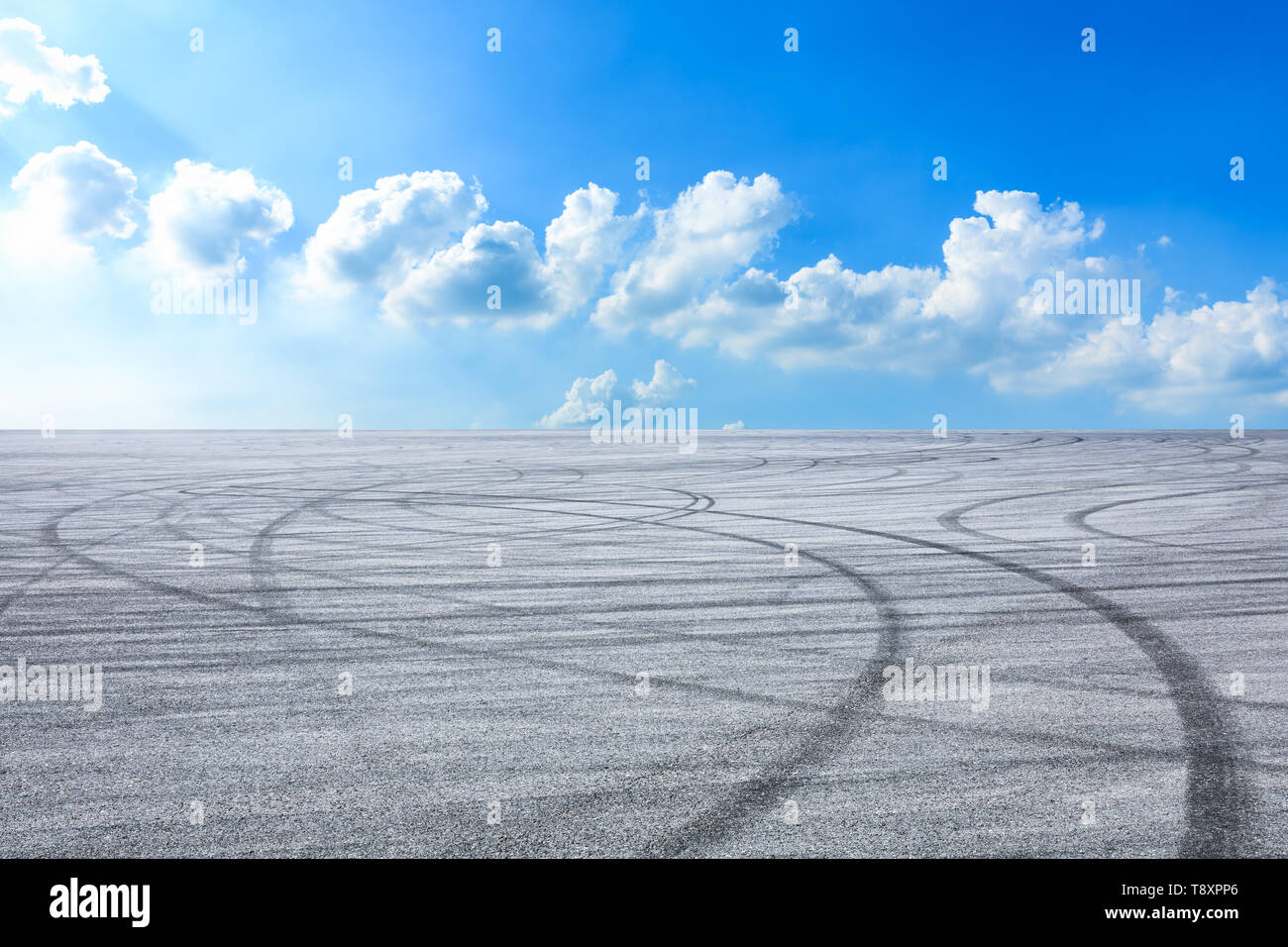 Empty asphalt race track ground and beautiful sky clouds Stock Photo ...