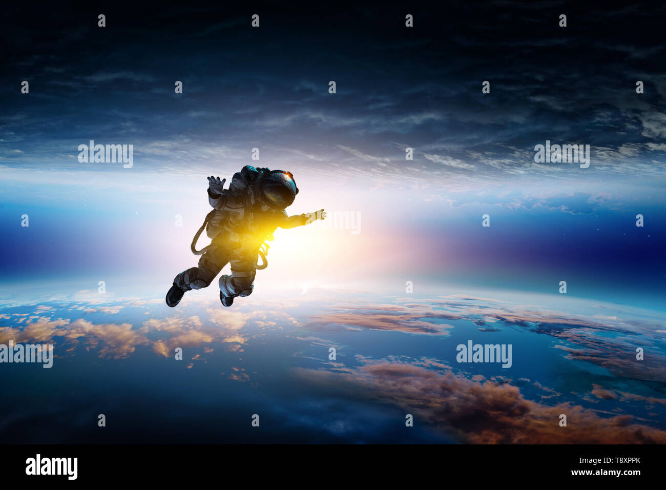 Spaceman and planet, human in space concept Stock Photo - Alamy