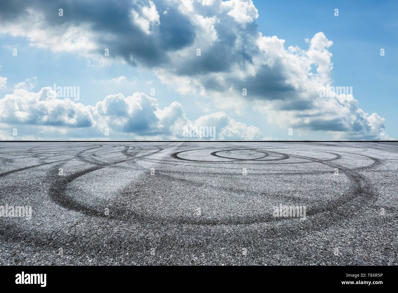 Empty asphalt race track ground and beautiful sky clouds Stock Photo ...