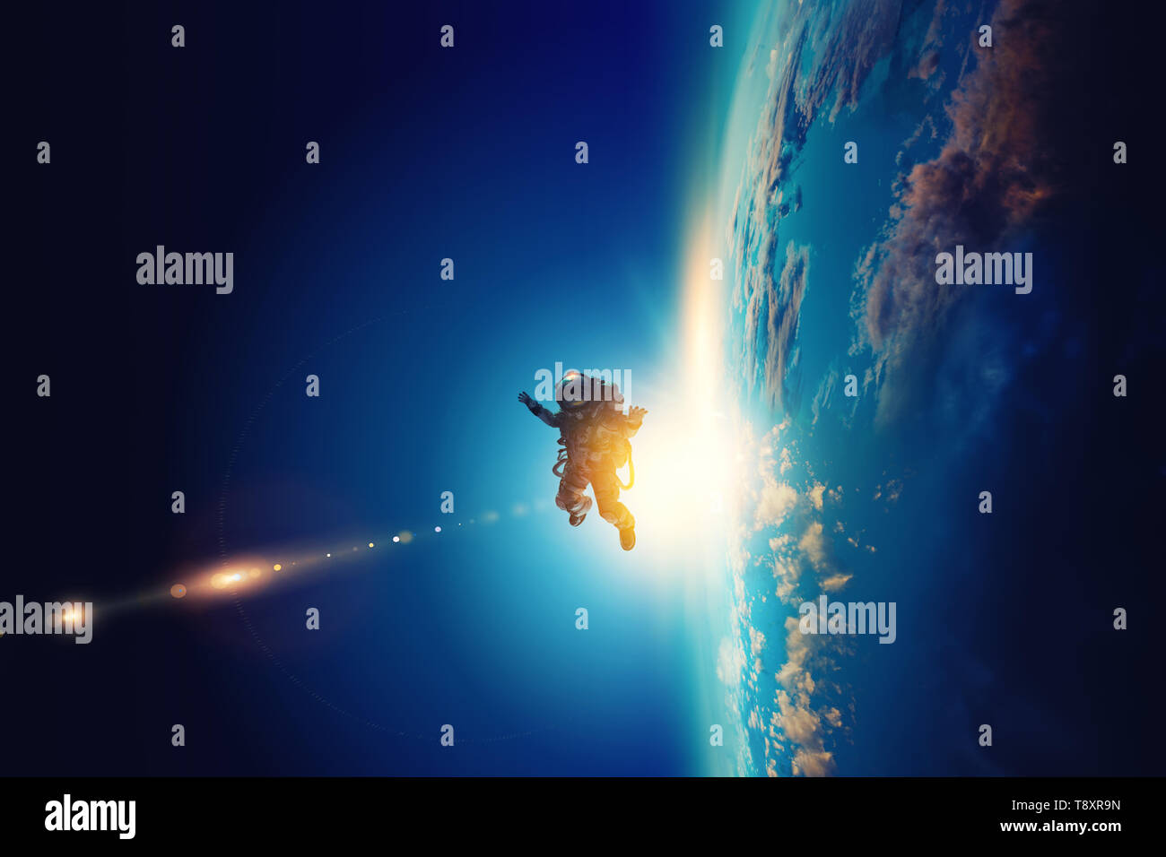Spaceman and planet, human in space concept Stock Photo - Alamy