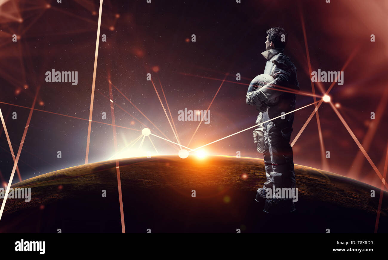 Spaceman and the planet Earth abstract theme Stock Photo - Alamy