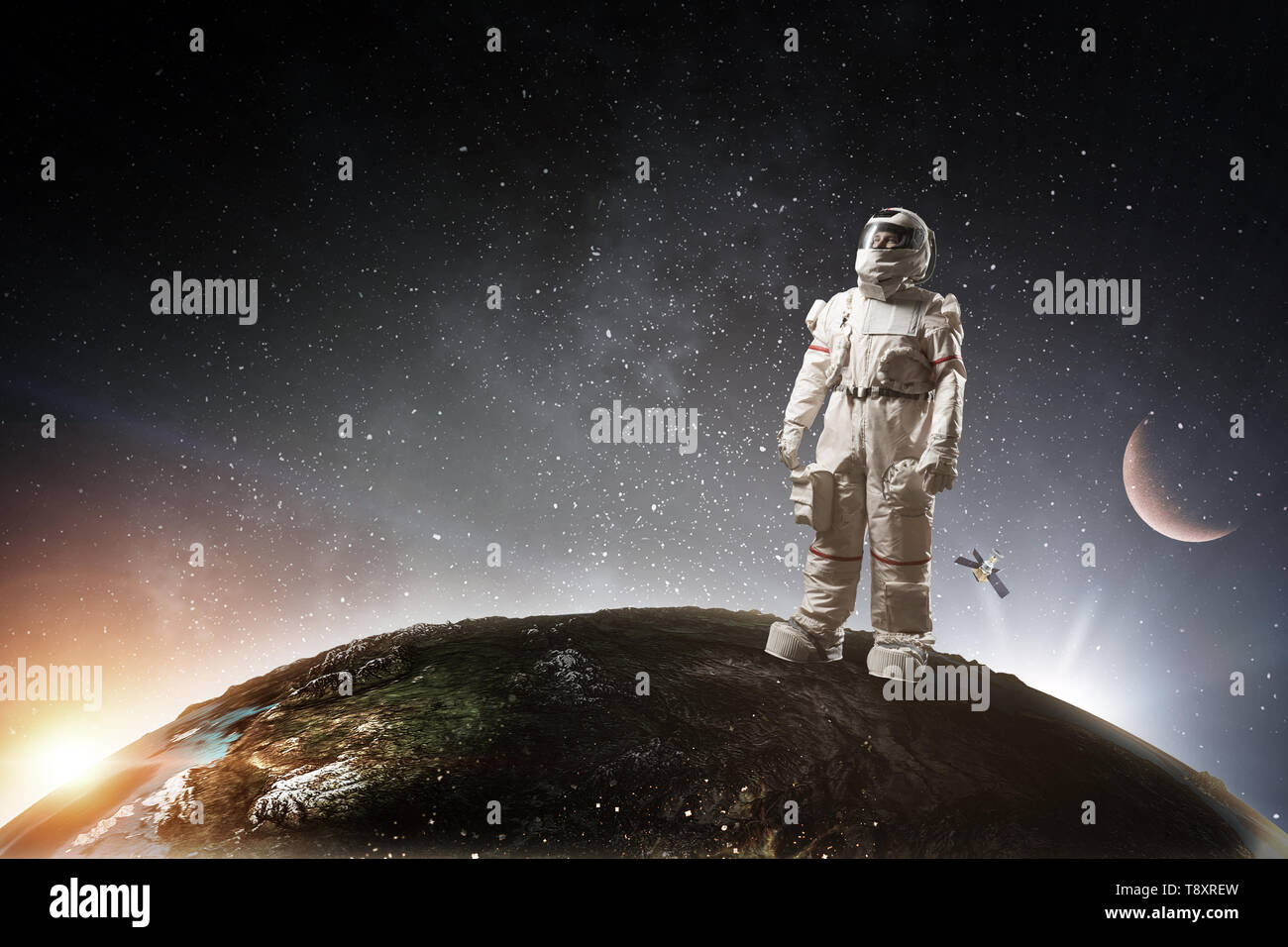 Spaceman and the planet Earth abstract theme Stock Photo - Alamy